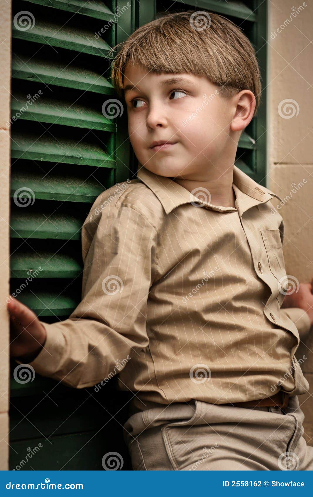 Boy at shuttered window stock photo. Image of shutters - 2558162