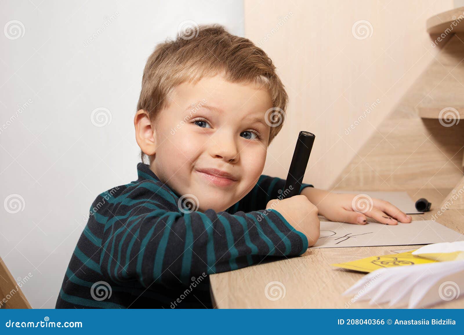 Boy Sit At The Table And Smile, While Drawing.Home Education Concept Or ...
