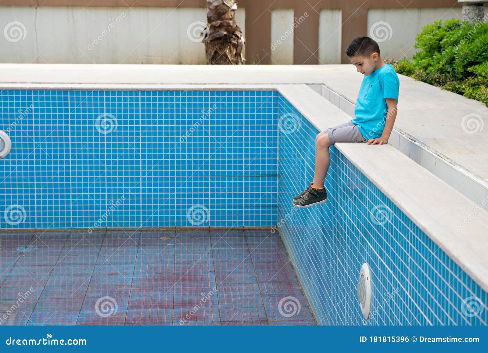 A Boy Sits by an Empty Pool. Concept Summer 2020. No Tourism Stock ...
