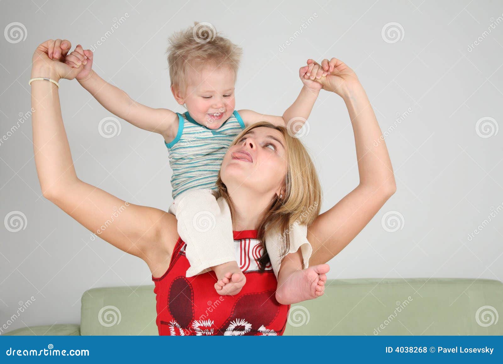 Boy Sits on Mother Shoulders Stock Photo - Image of hand, parent: 4038268