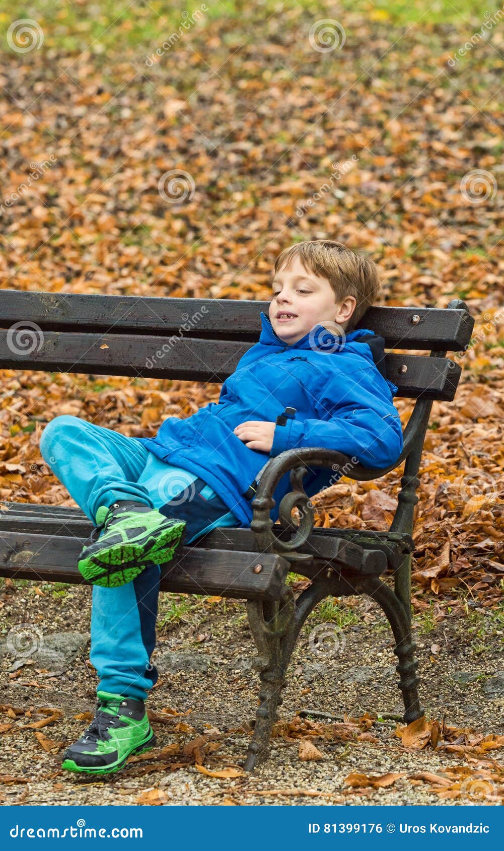 Boy sitting on bench stock photo. Image of bench, rest - 81399176