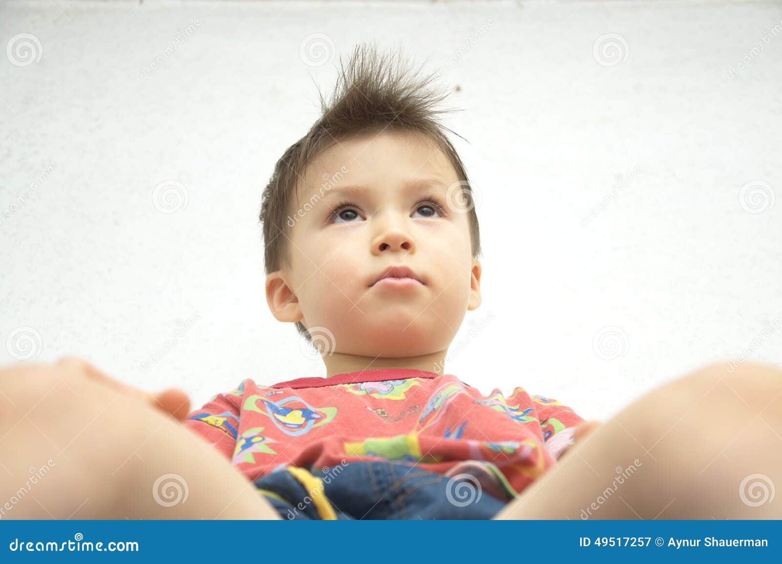 Boy sitting, bottom view stock image. Image of watch - 49517257