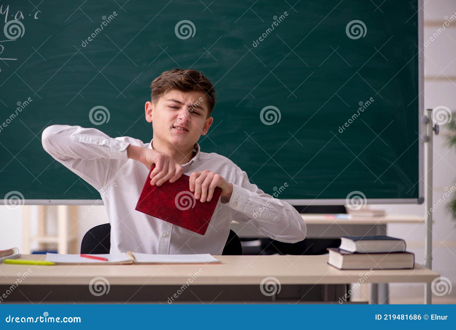 Boy Sitting in the Classrom Stock Photo - Image of classroom ...