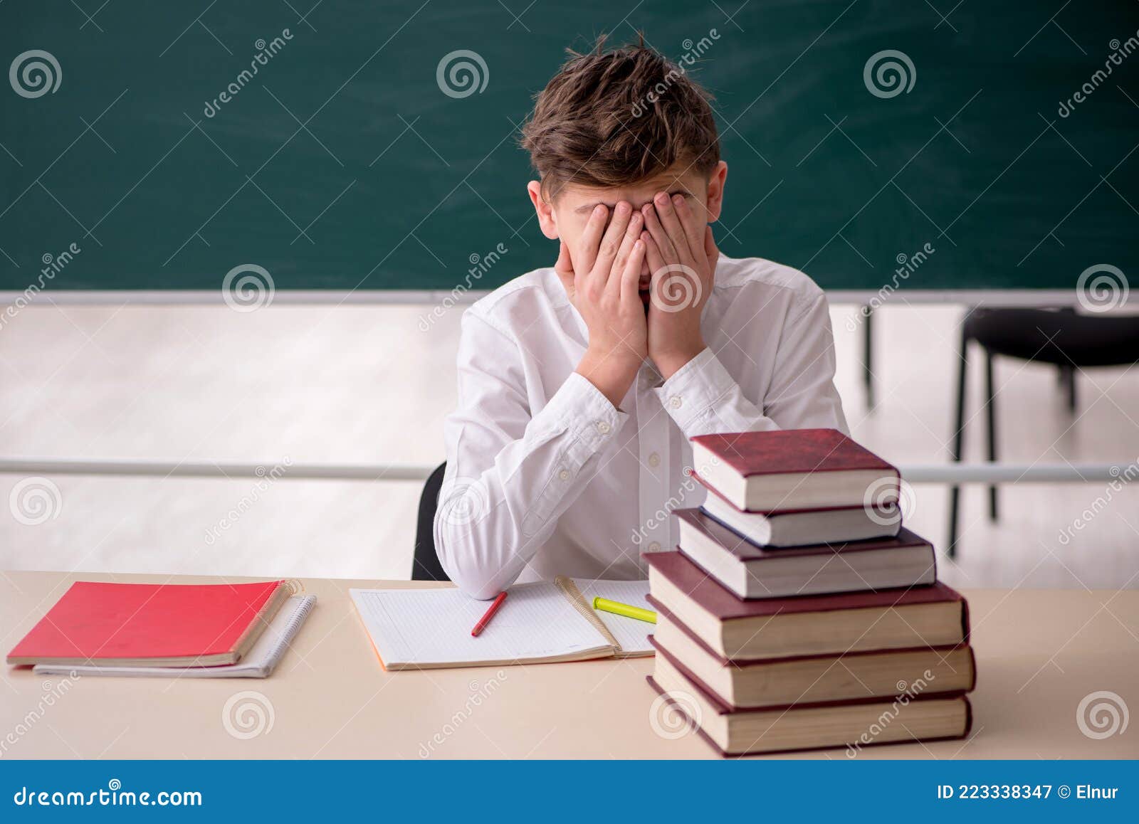 Boy Sitting in the Classrom Stock Image - Image of class, books: 223338347