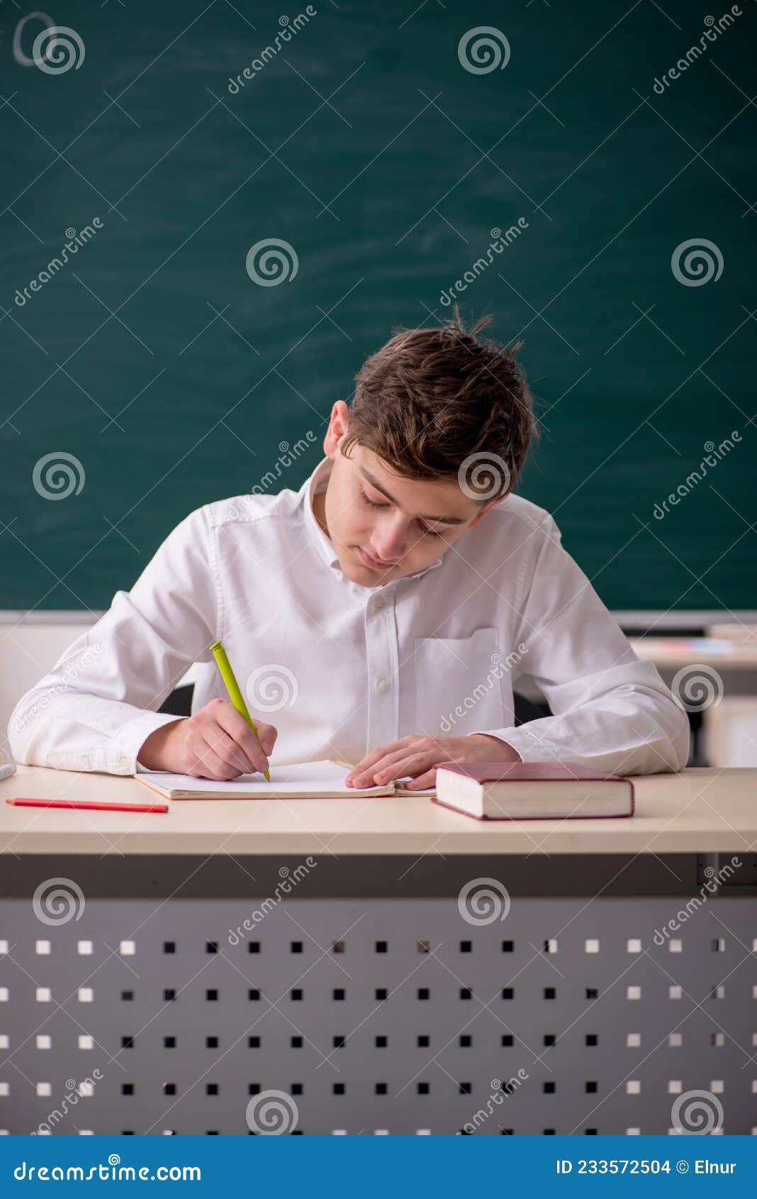 Boy Sitting in the Classrom Stock Photo - Image of training, chalkboard ...