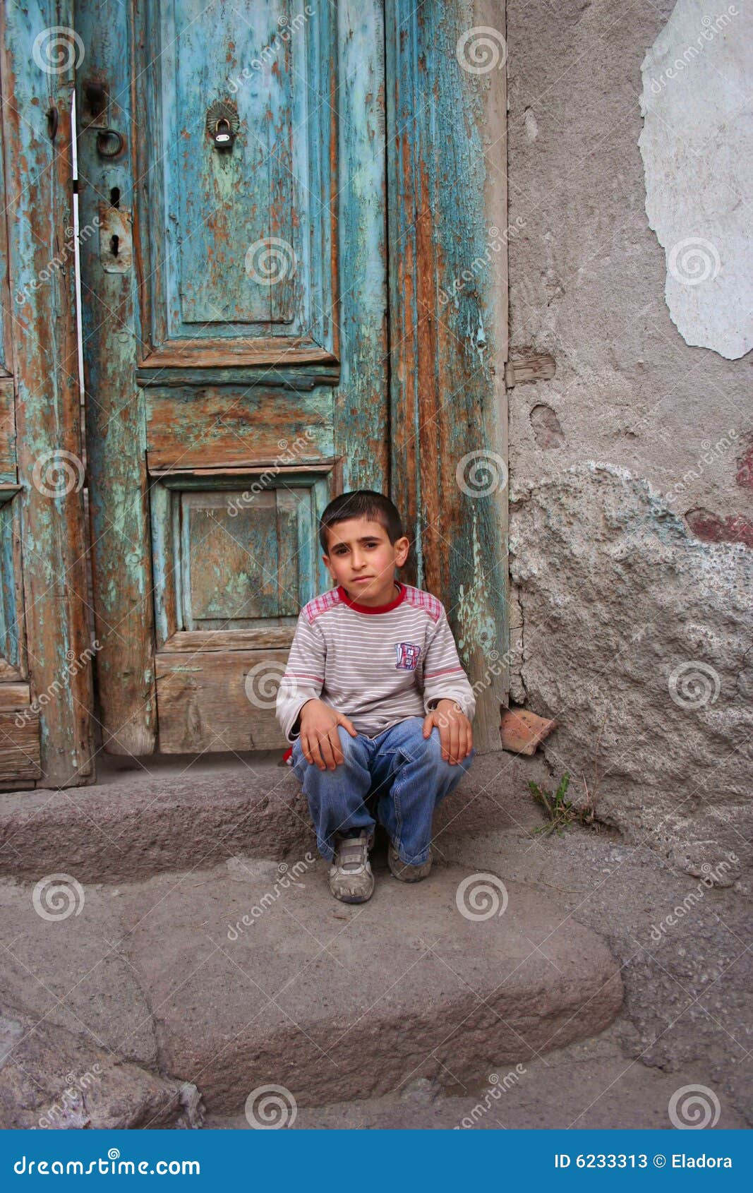A Boy Sitting at the Doorstep Stock Image - Image of bluejeans, denim ...
