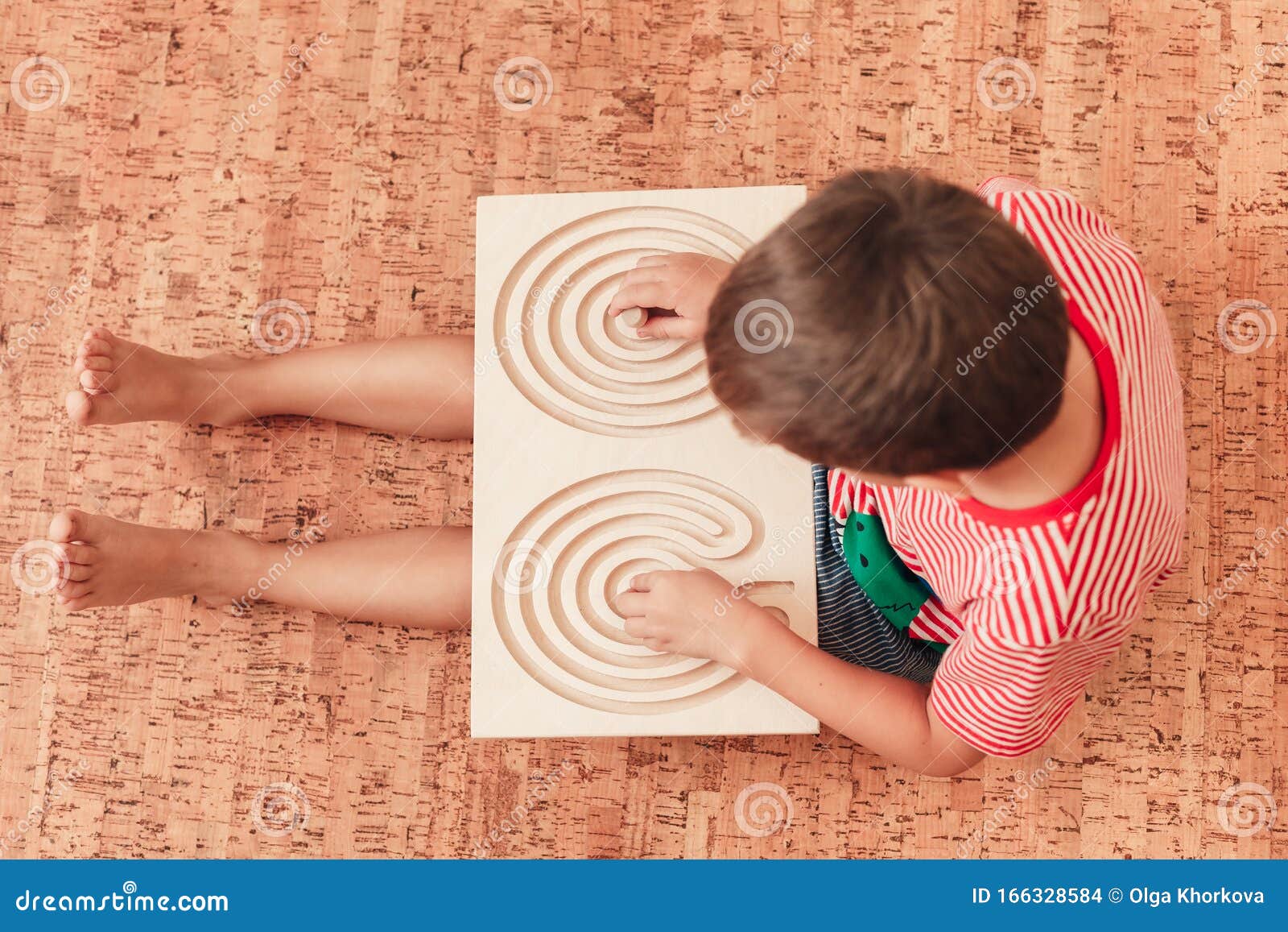 Boy Sitting on Floor with Double-sided Interhemispheric Board Stock ...