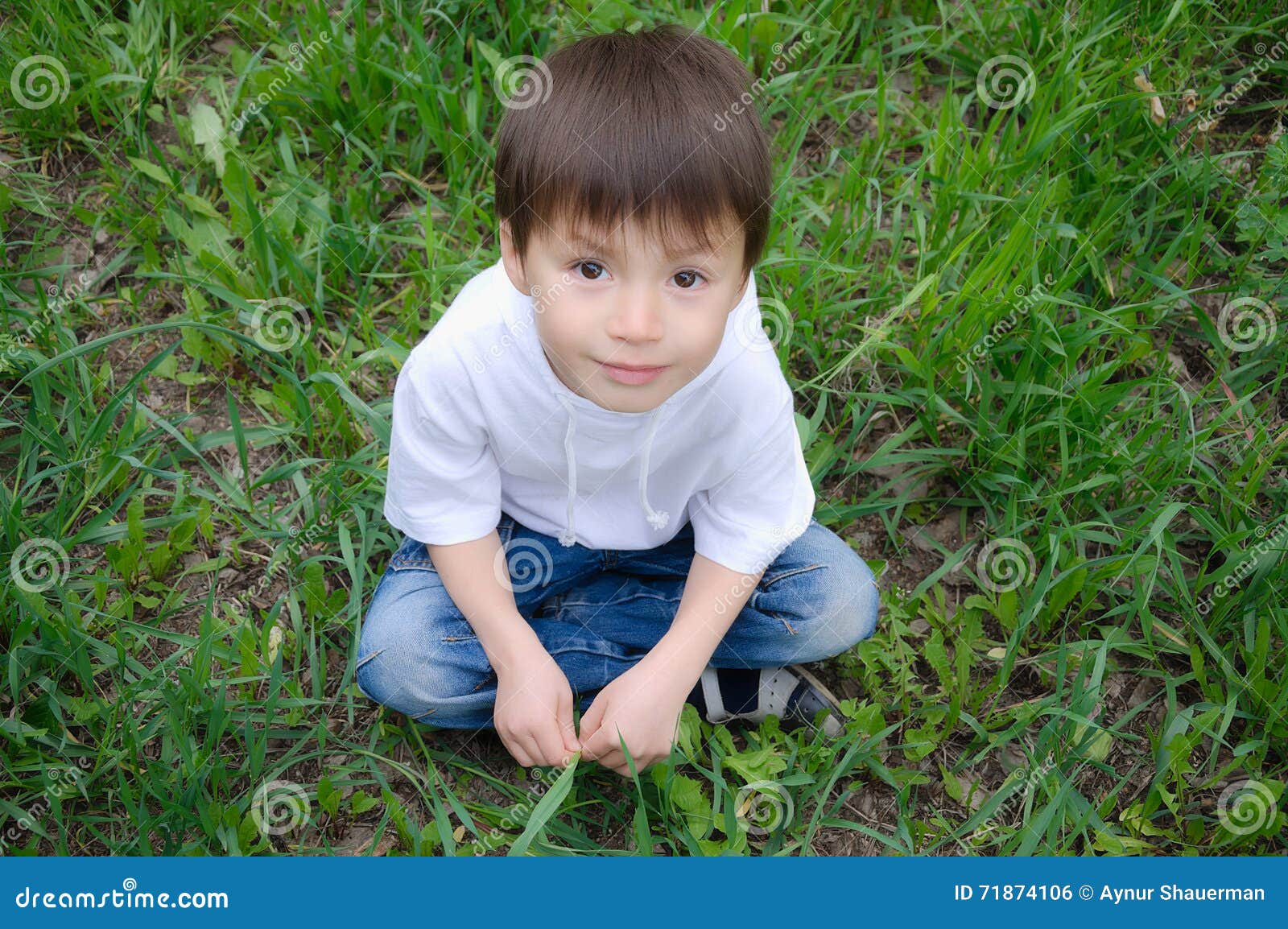 Boy Sitting on the Grass Outside Stock Photo - Image of comfort, child ...