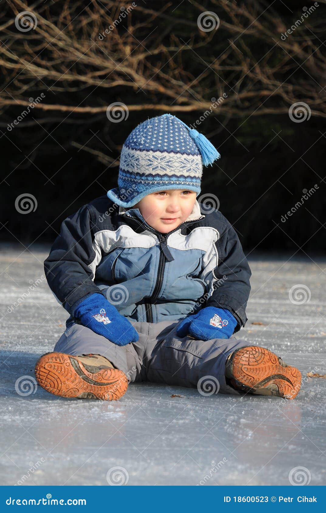 Boy sitting on ice stock image. Image of frozen, outdoor - 18600523