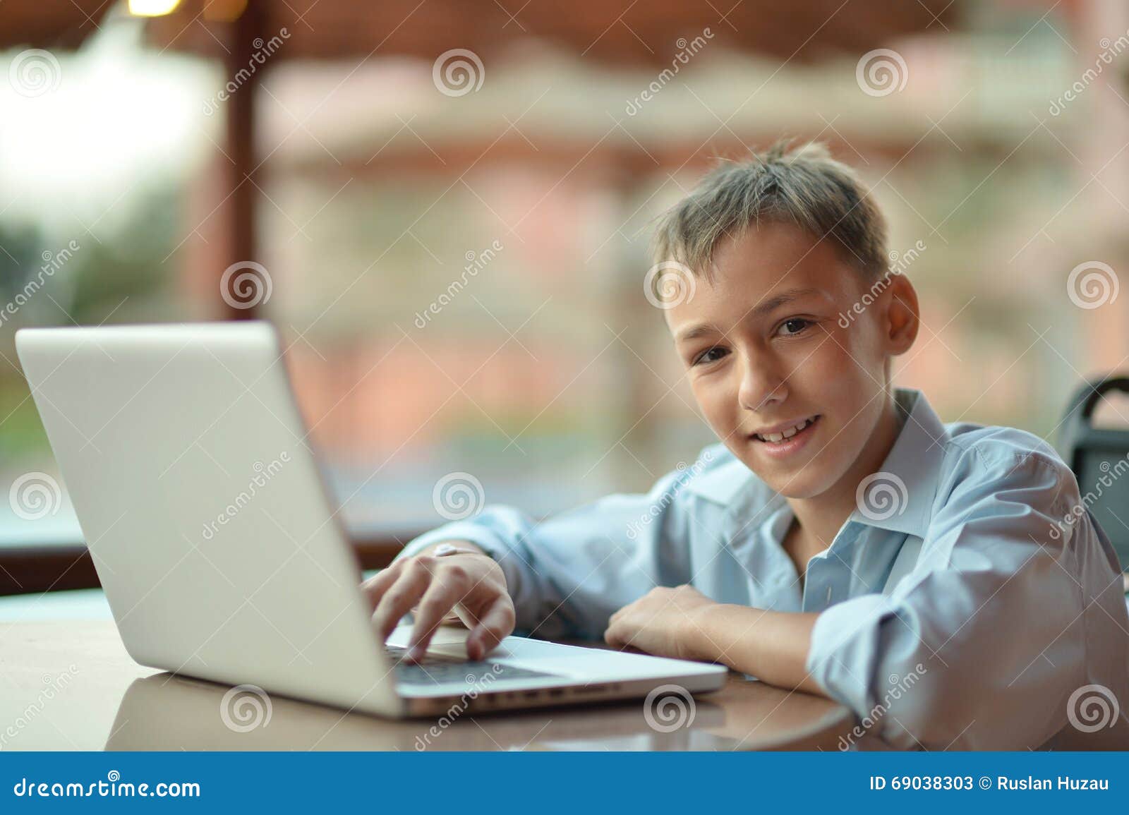 Boy sitting with laptop stock image. Image of drink, lovely - 69038303