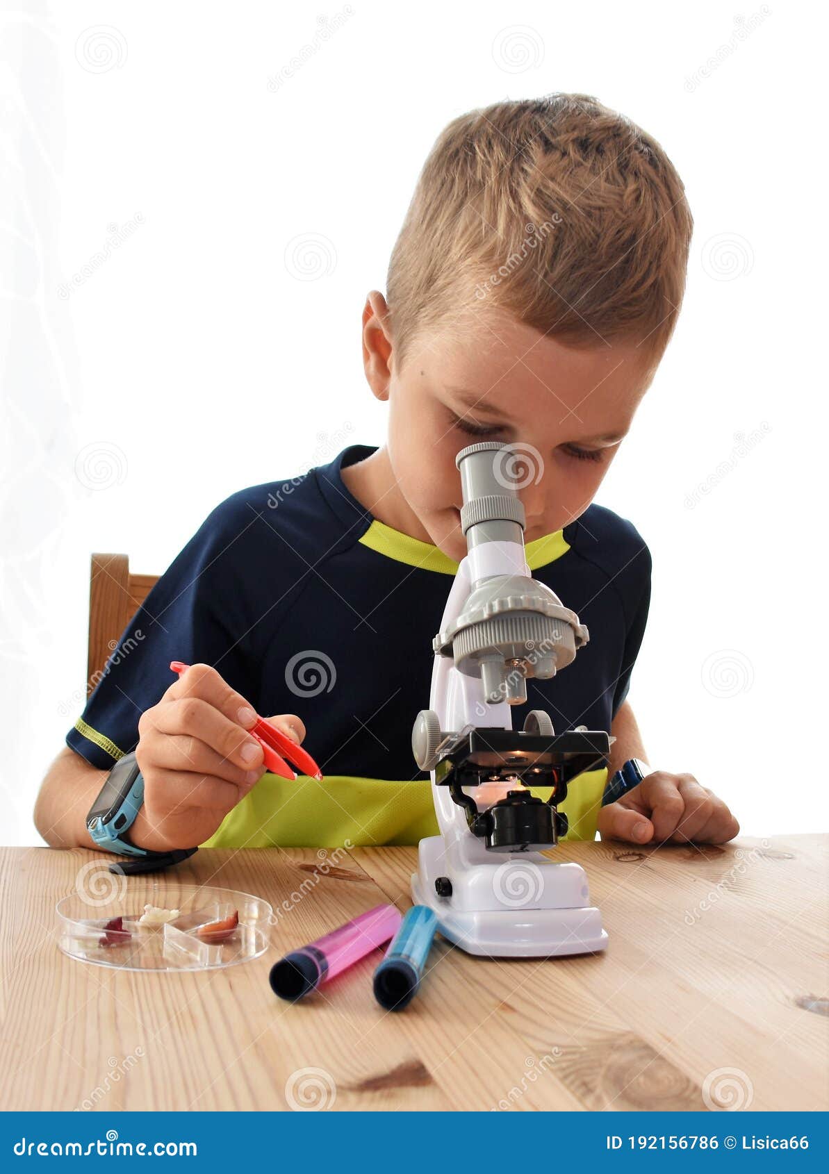 Boy Sitting and Looking through a Microscope Stock Photo - Image of ...