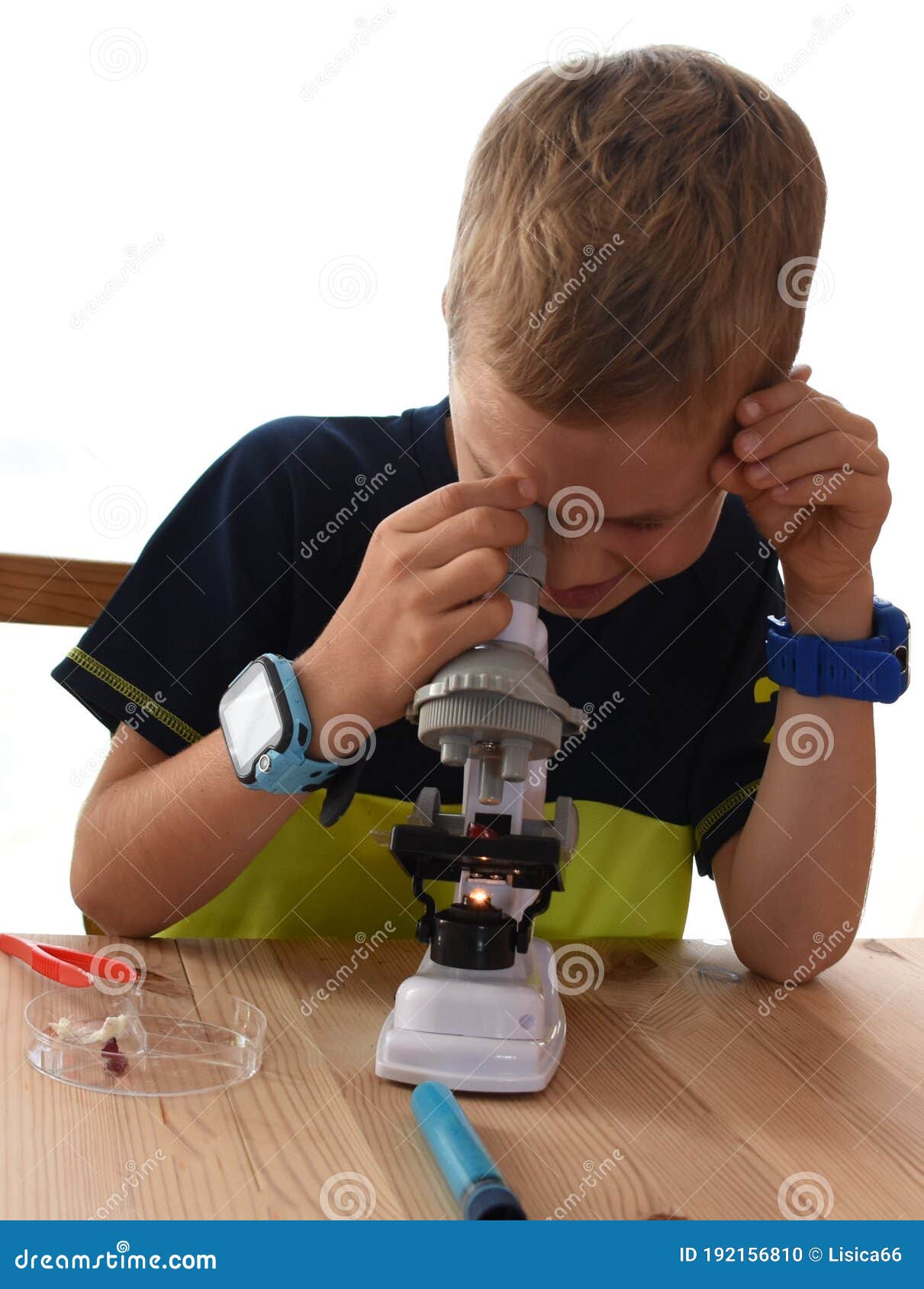Boy Sitting and Looking through a Microscope Stock Photo - Image of ...