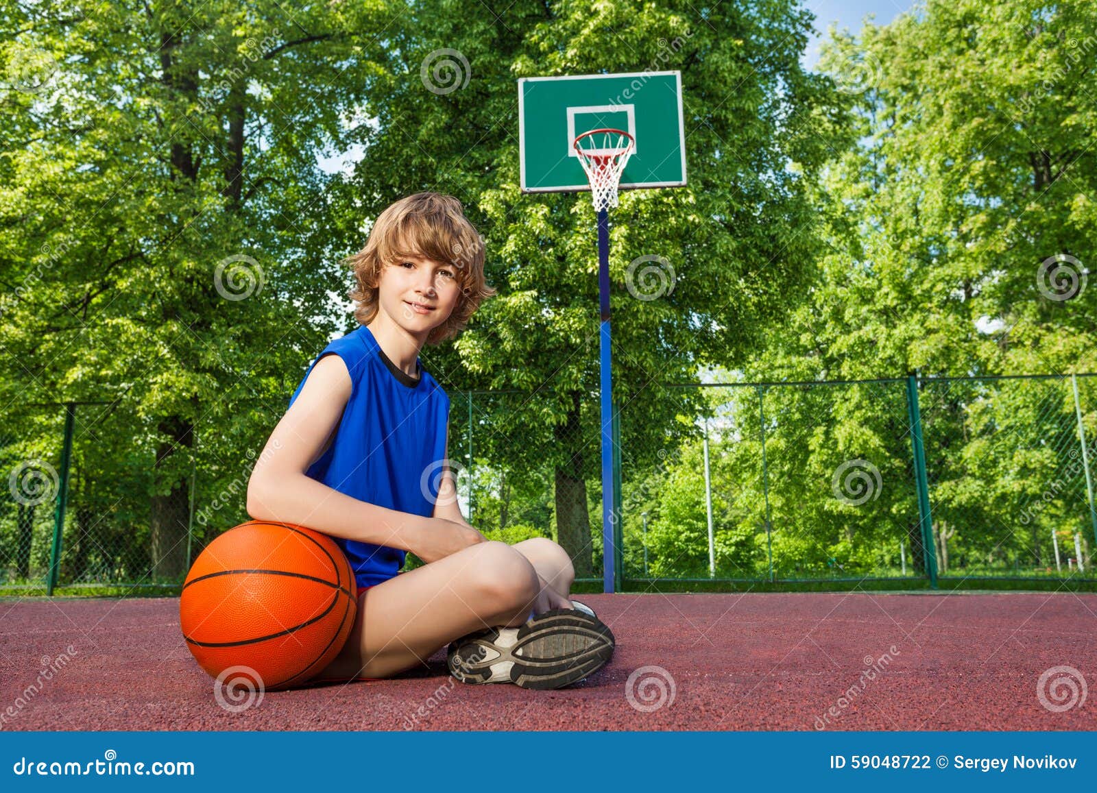 Boy Sitting on the Playground with Ball Stock Photo - Image of ...
