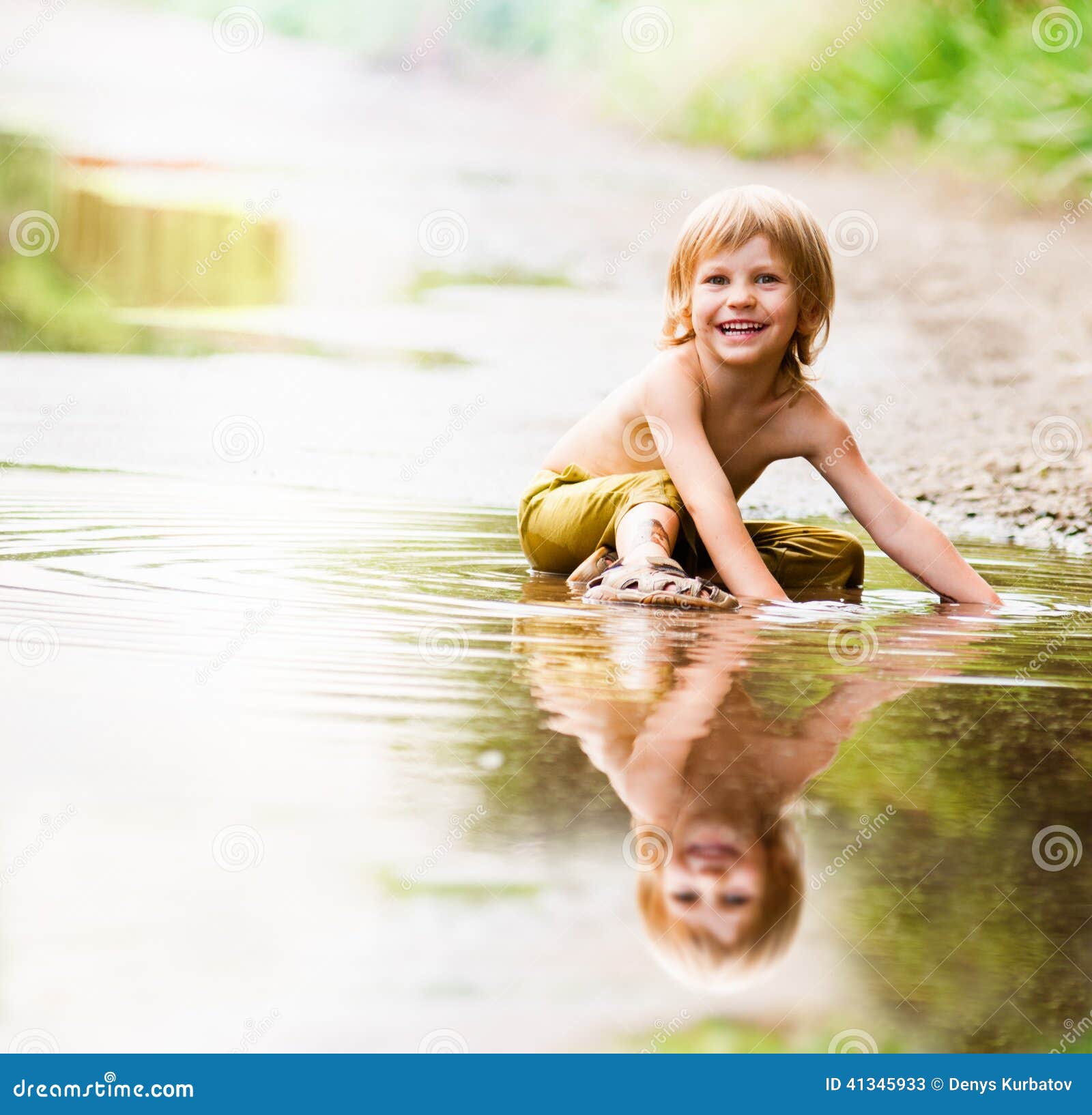 Boy sitting in puddle stock image. Image of blonde, happiness - 41345933