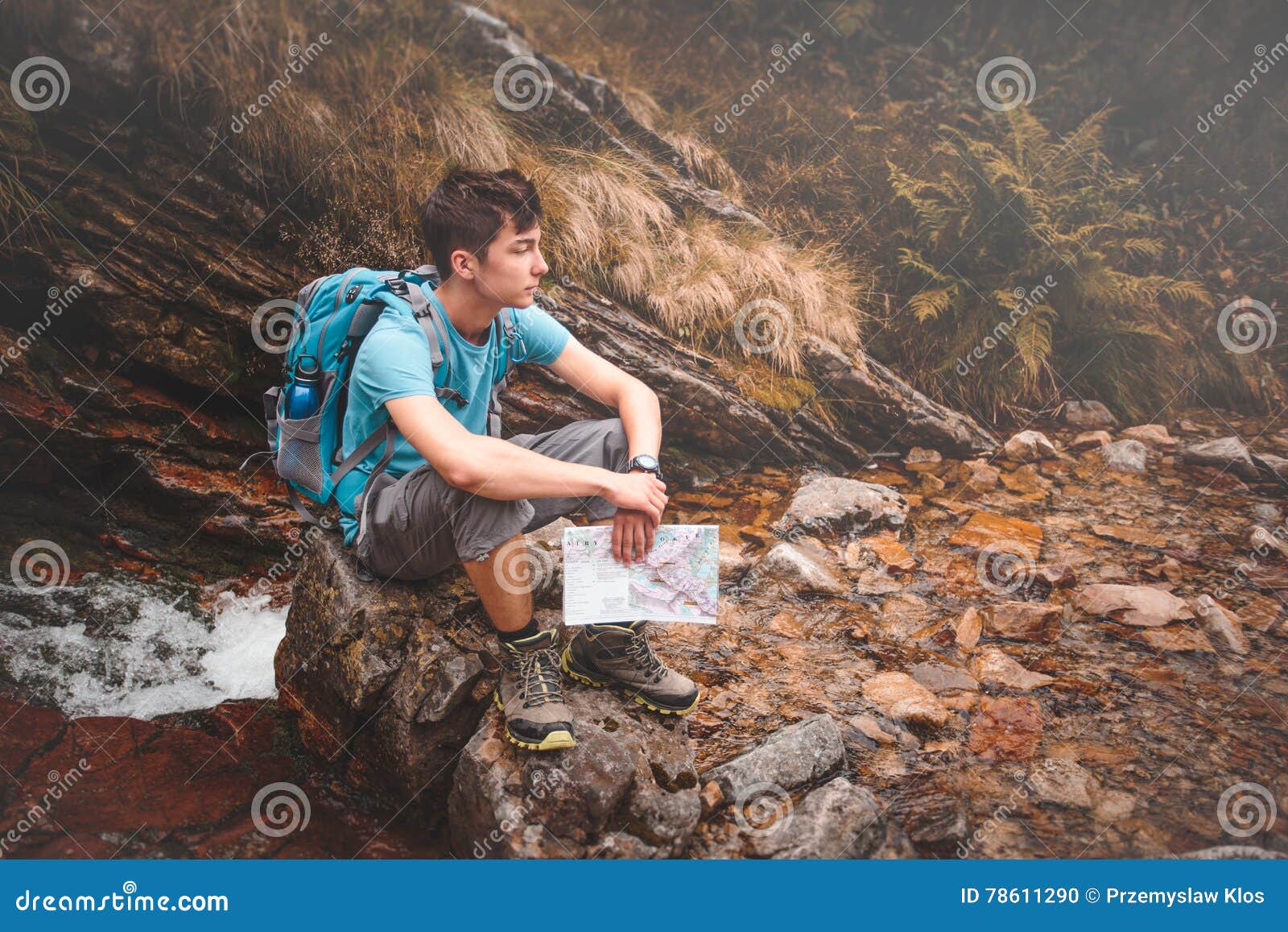 Boy Sitting on a Rock on Mountain Trail Stock Photo - Image of teenager ...