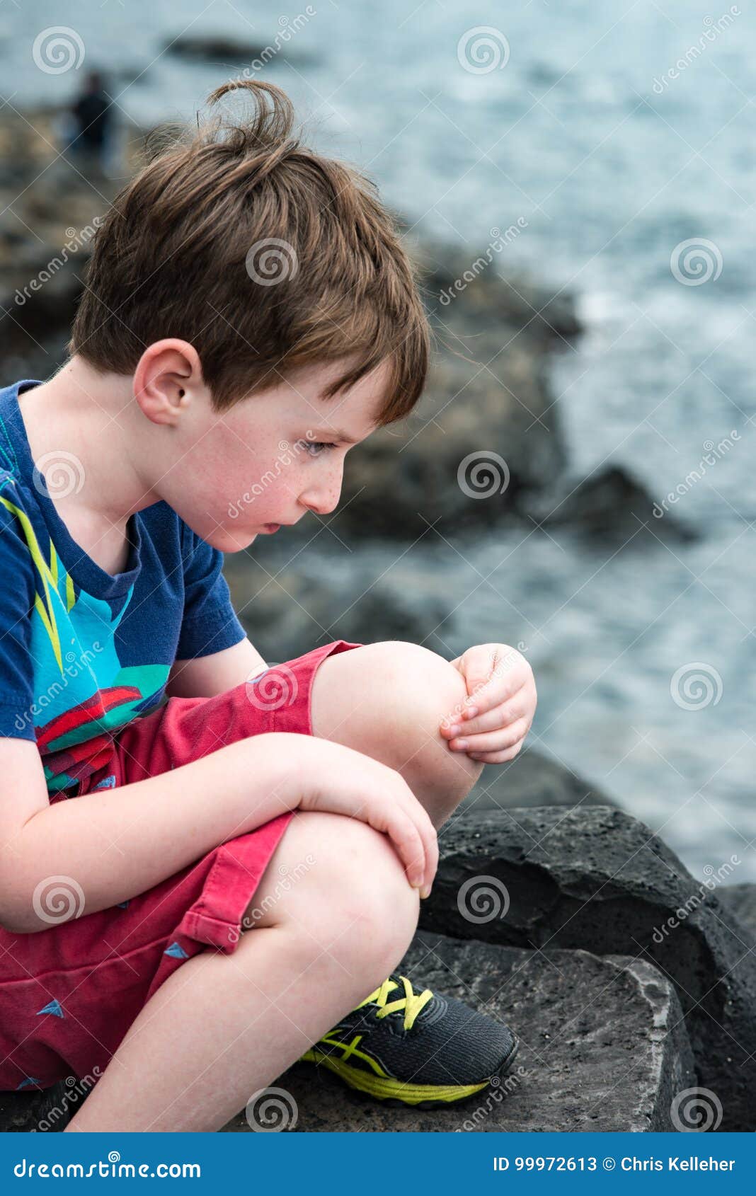 Boy Sitting on the Rocks at Giant`s Causeway Stock Image - Image of ...