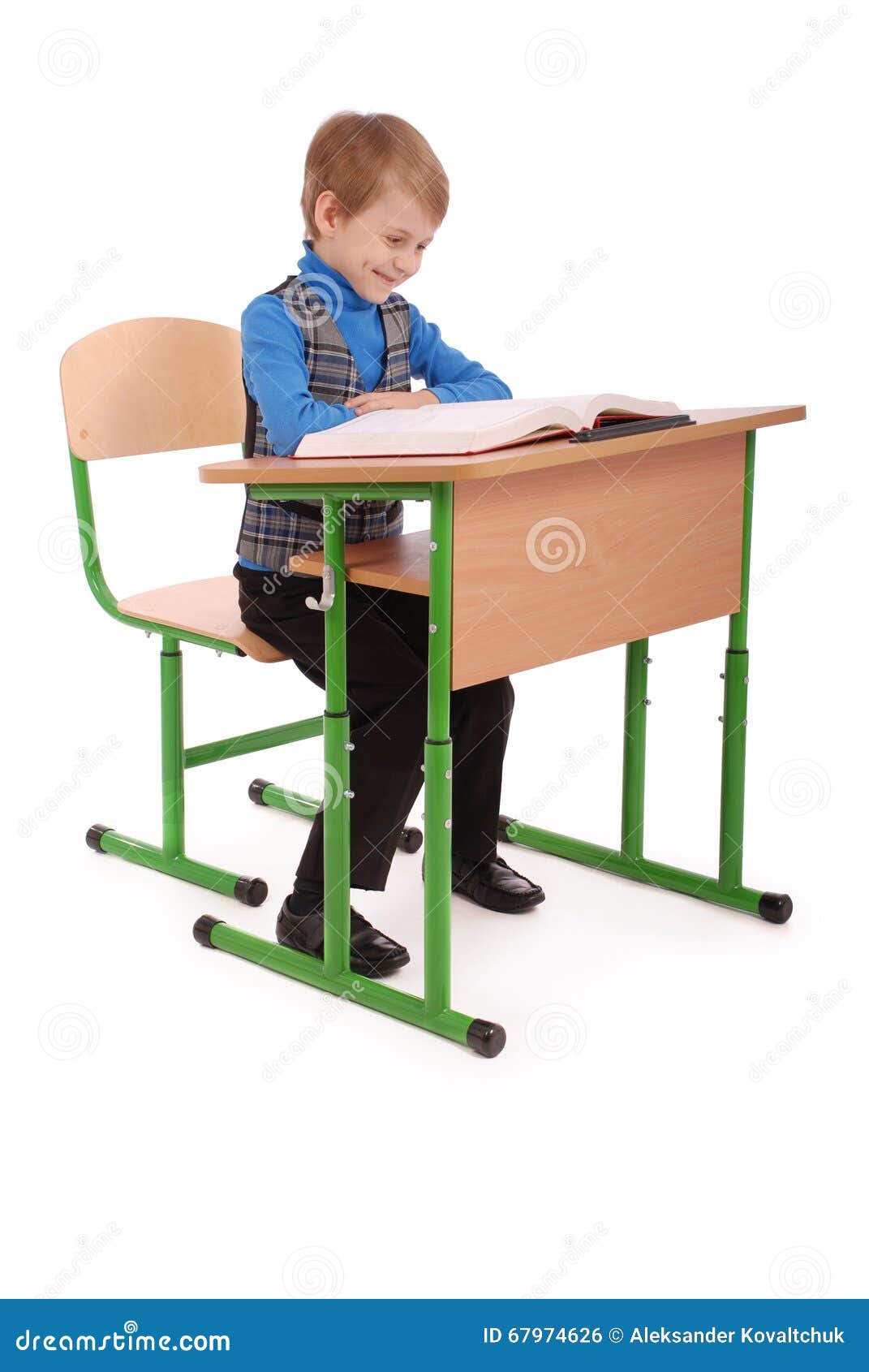 Boy Sitting at a School Desk Stock Photo - Image of education, smiling ...
