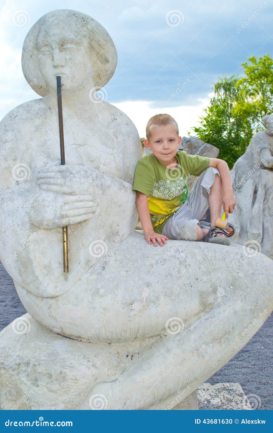 Boy Sitting on a Stone Statue Stock Photo - Image of activity, children ...