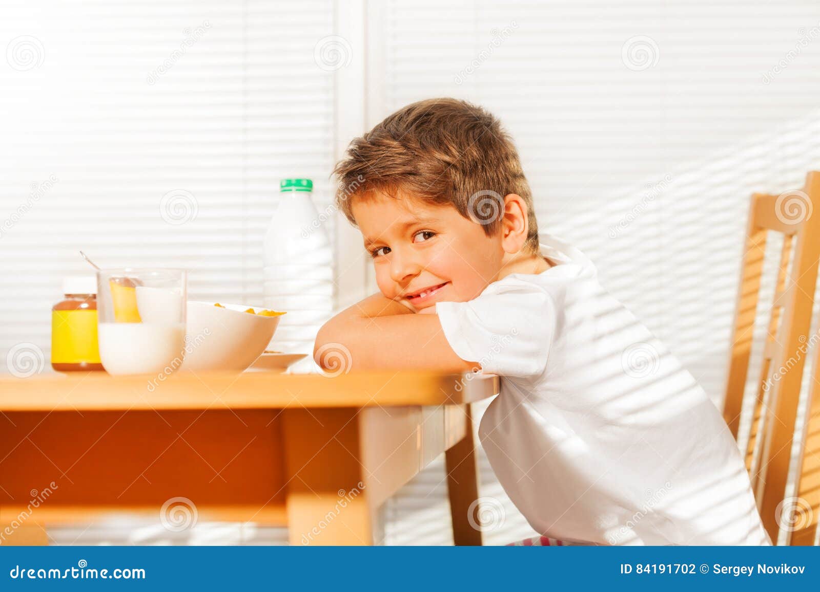 Boy Sitting at Table during Breakfast in Kitchen Stock Photo - Image of ...