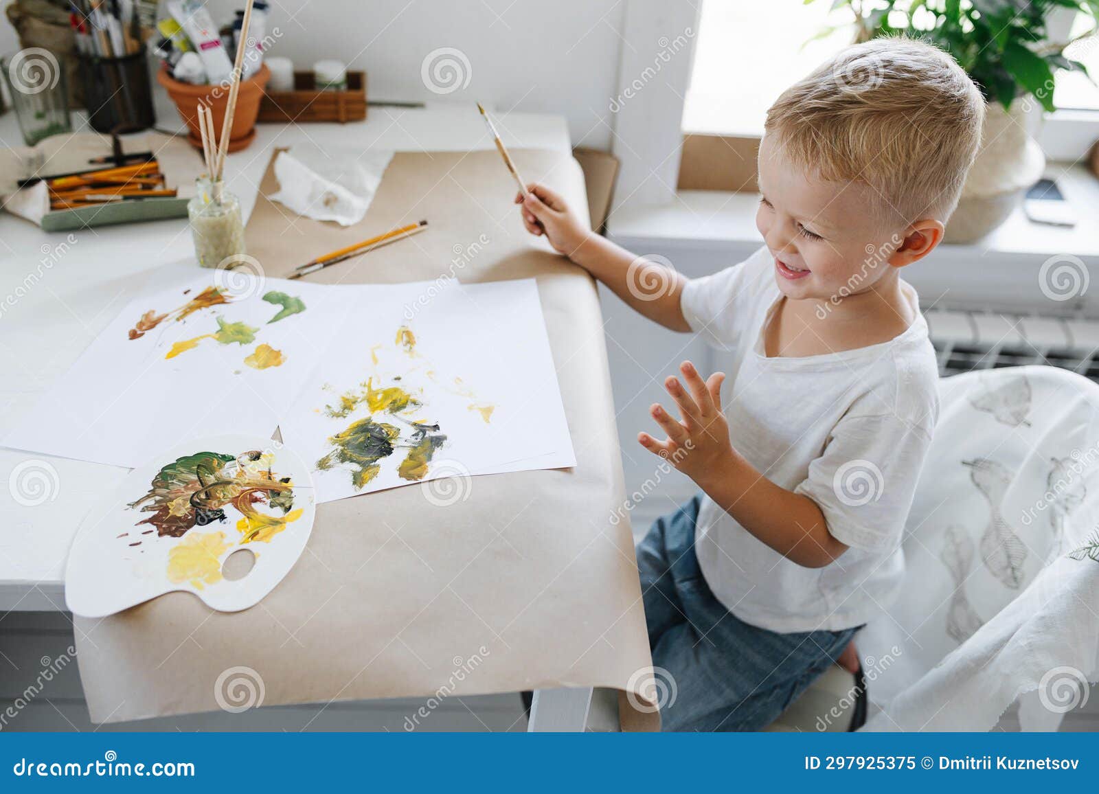 Boy Sitting at the Table Drawing with Paints Stock Image - Image of ...