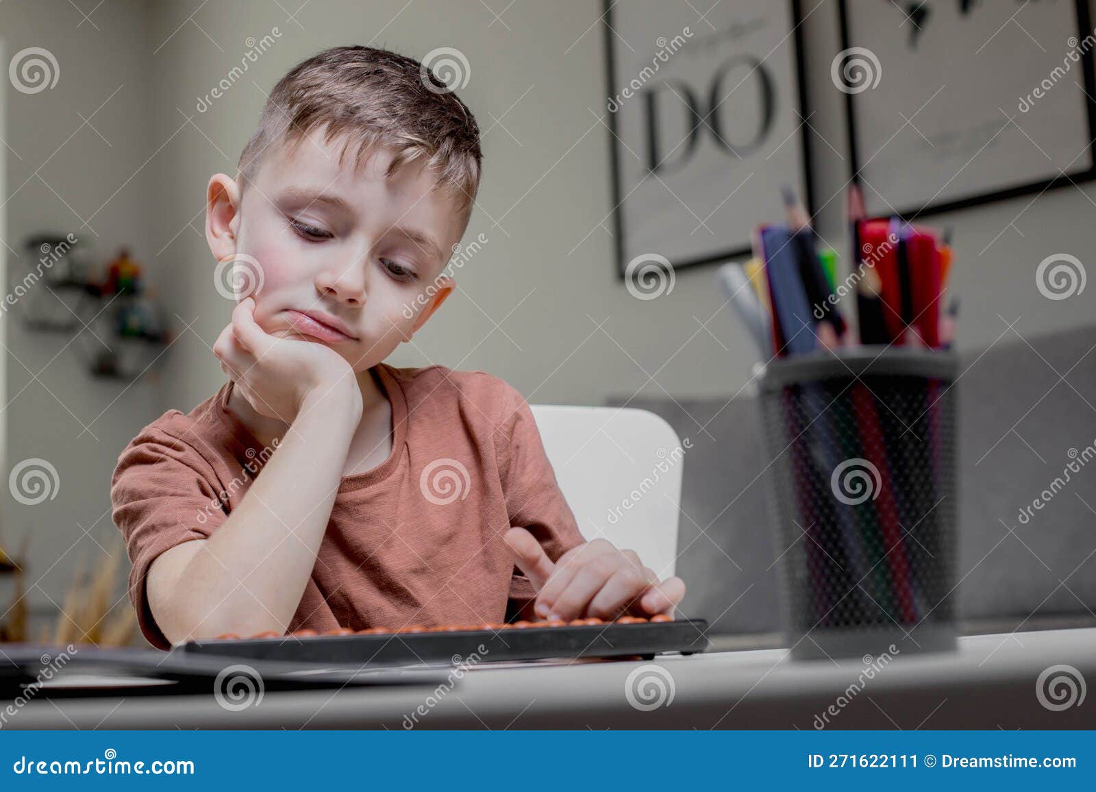 Boy Sitting at the Table, Studying Mathematics, Got Tired and Leaned on ...