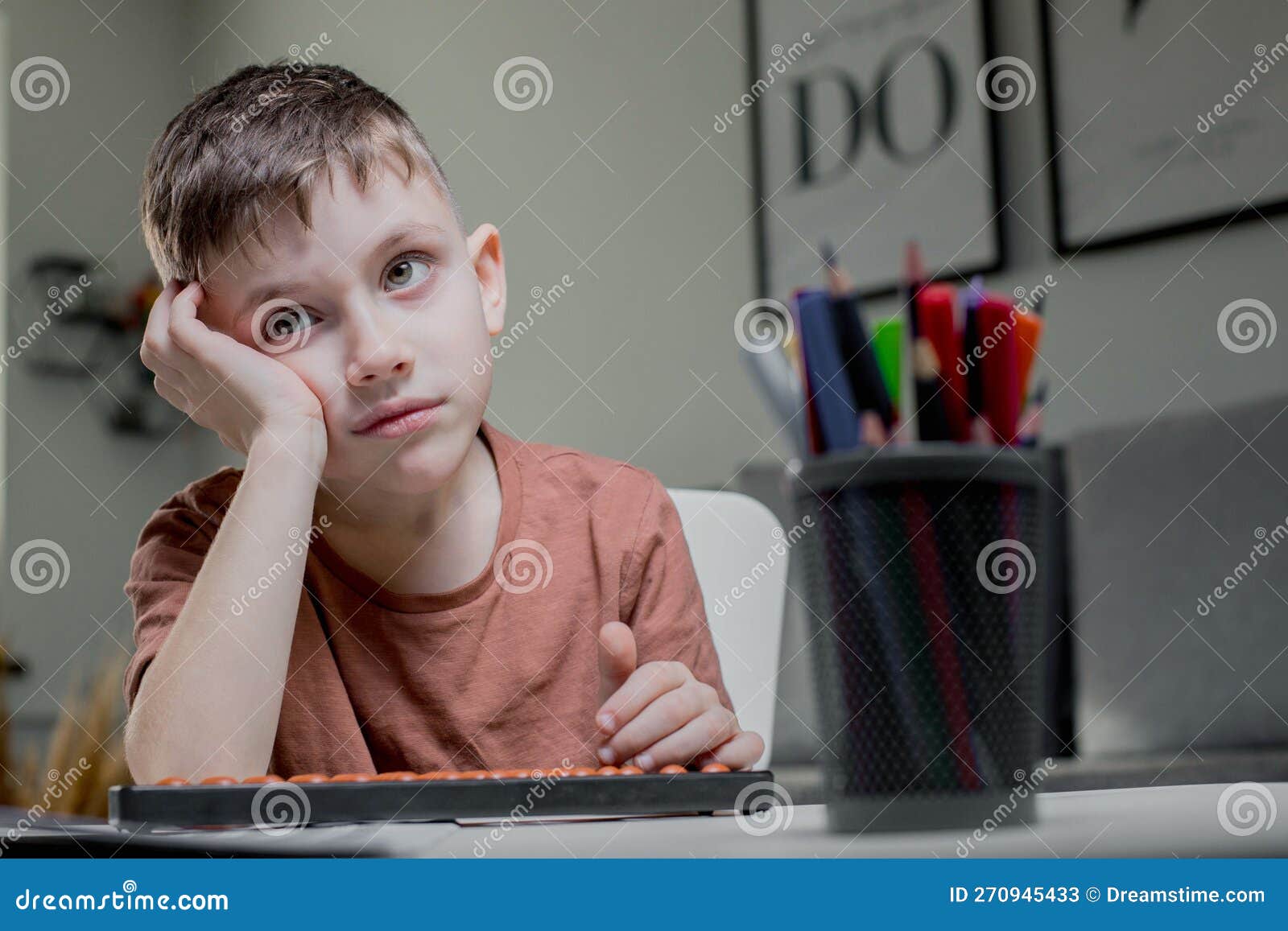 Boy Sitting at the Table, Studying Mathematics, Got Tired and Leaned on ...