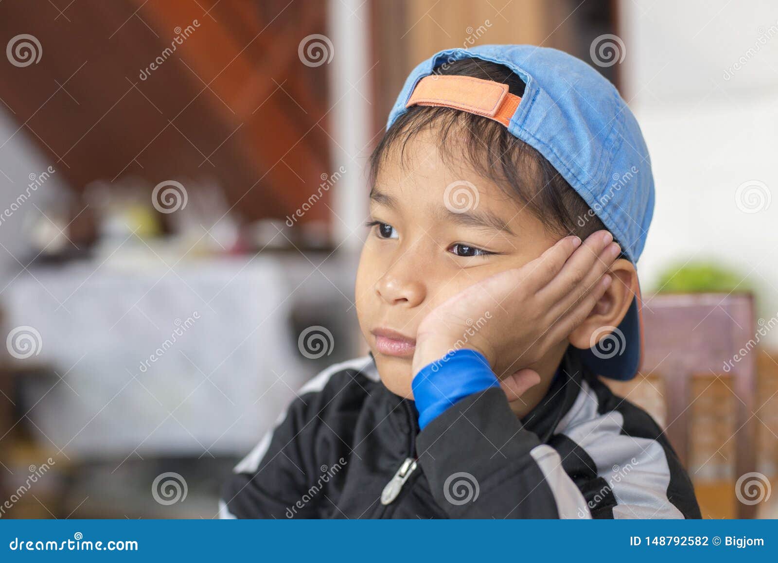 Boy Sitting on the Table, Thinking about Something Stock Photo - Image ...