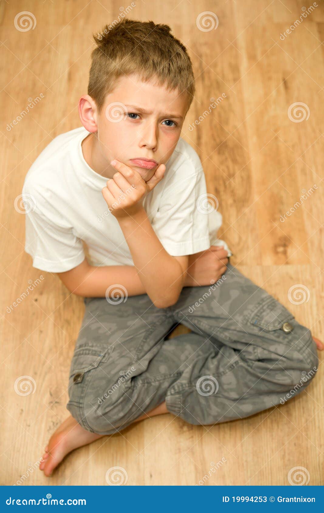 Boy sitting and thinking stock image. Image of wondering - 19994253