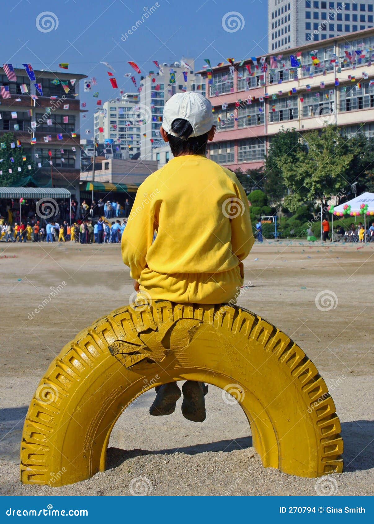 Boy sitting on tire stock photo. Image of sport, wait, exercise - 270794