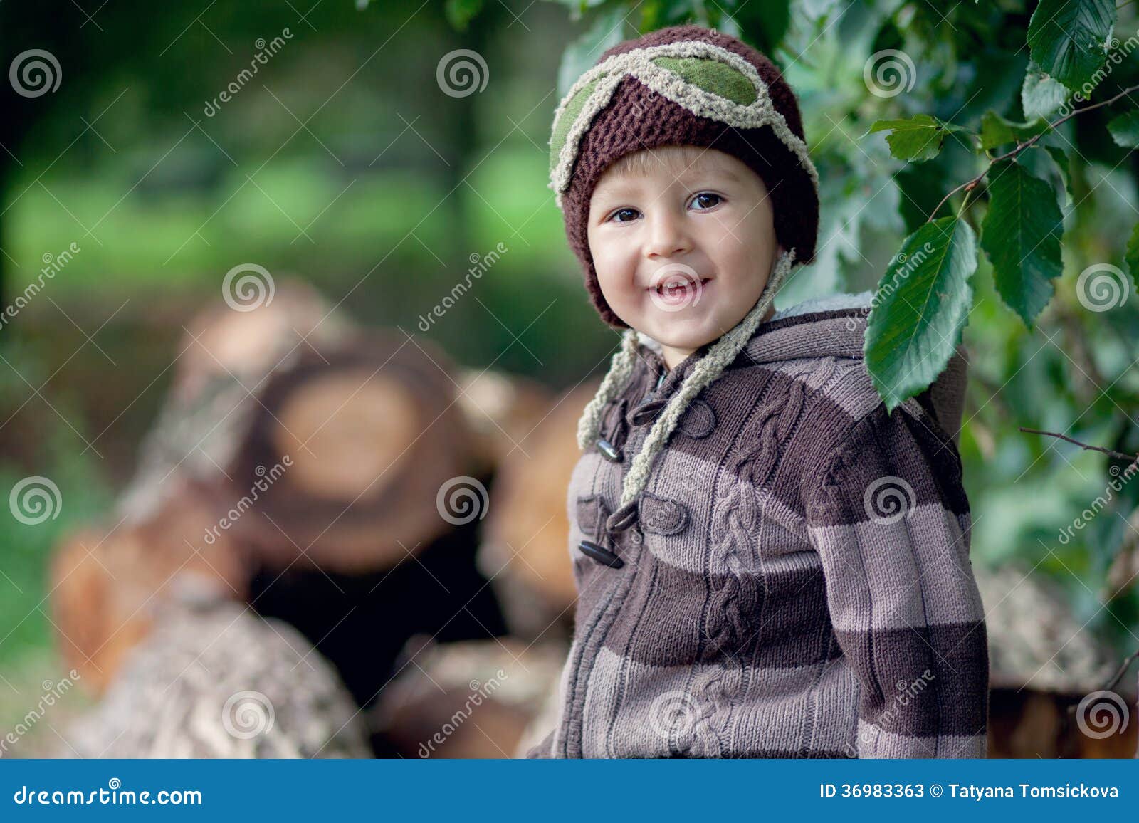 Boy, Sitting on a Tree Trunks Stock Image - Image of forest, trunk ...