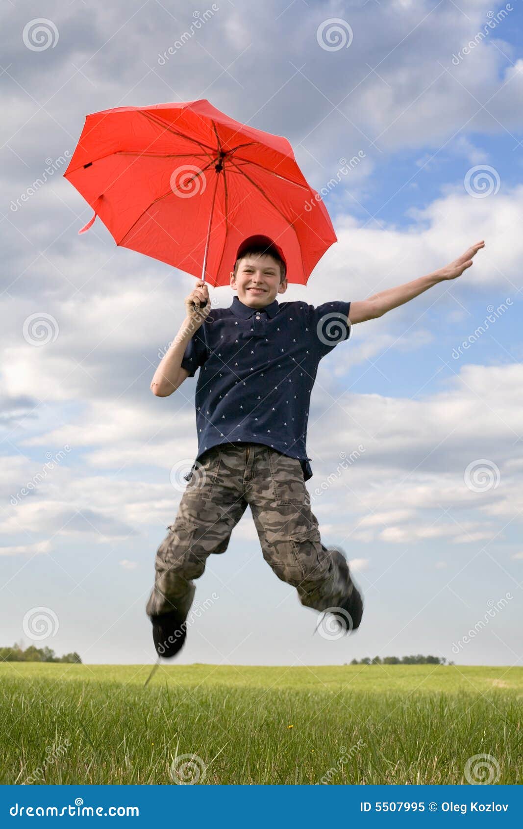 Boy in sky stock image. Image of person, jump, grass, caucasian - 5507995