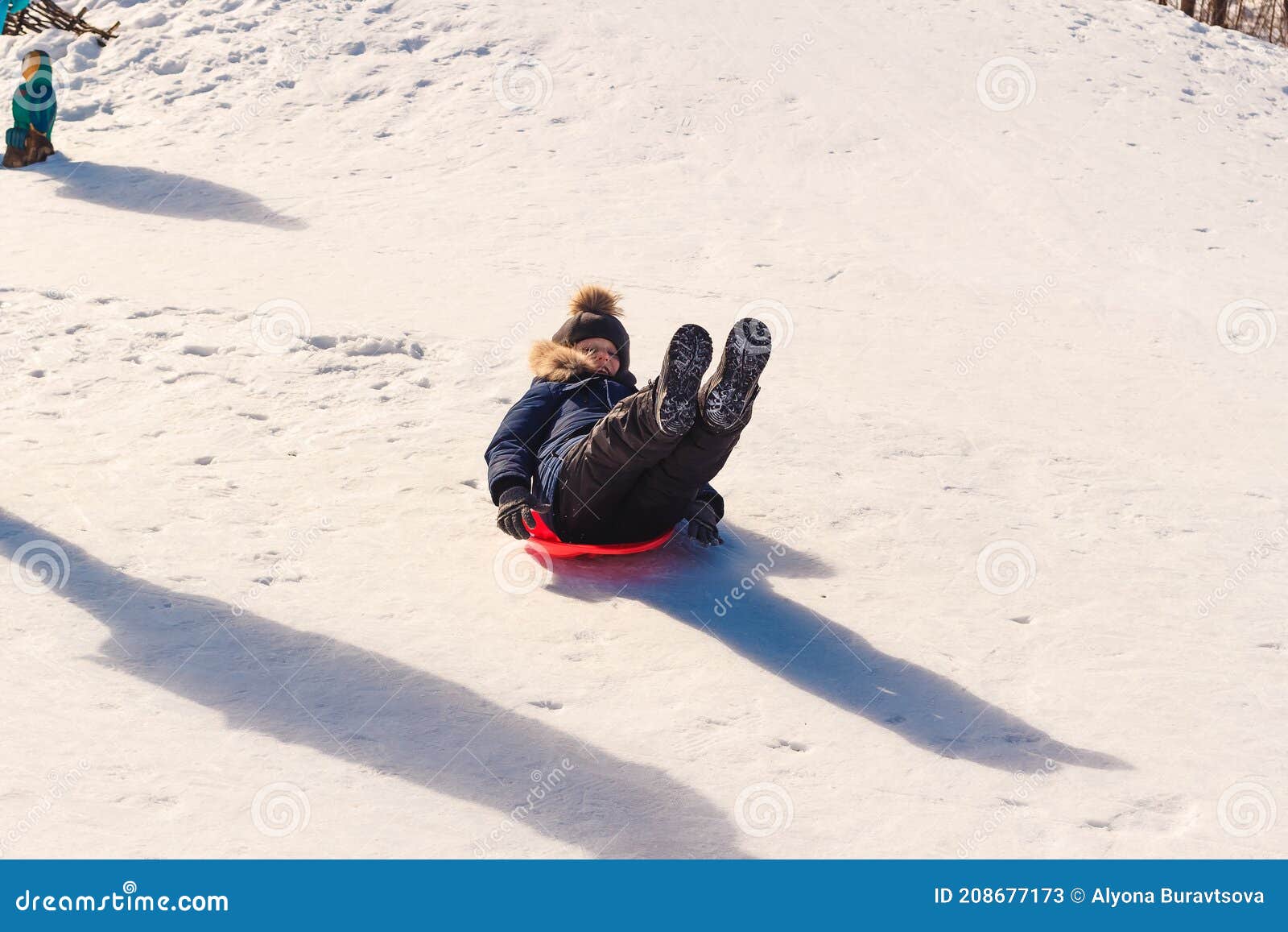 Boy on Sled Ice Rides from the Hill in Winter Stock Image - Image of ...