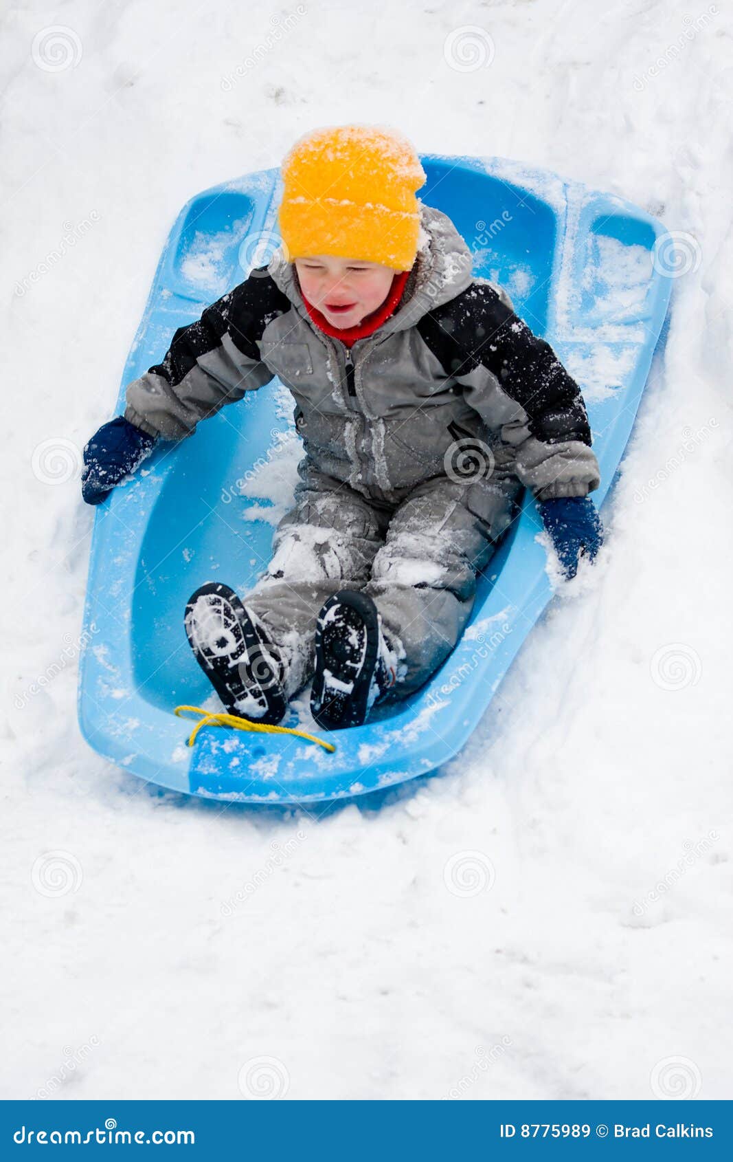 Boy sledding down hill stock image. Image of snow, ride - 8775989