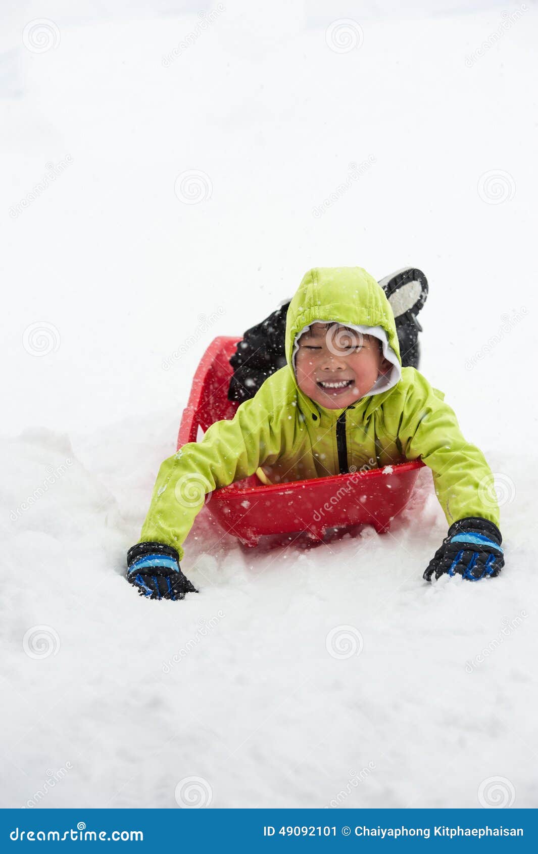 Boy on Sledge stock image. Image of sledging, sledding - 49092101