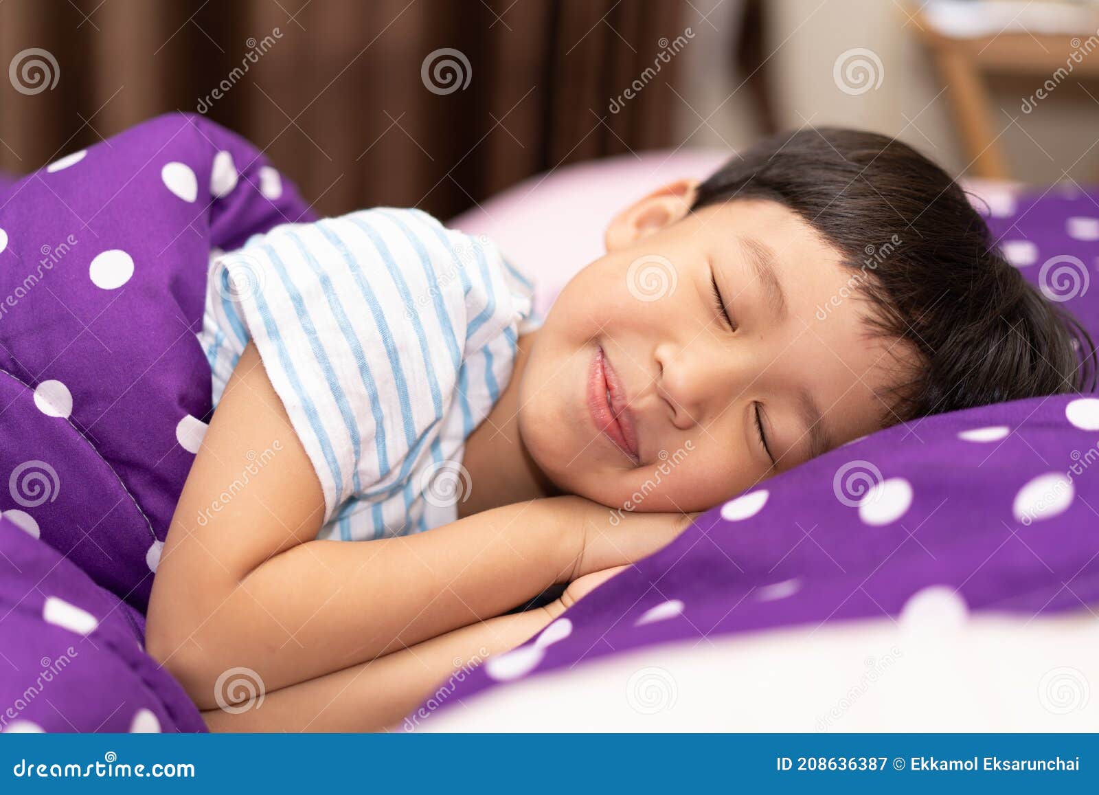 A Boy is Sleeping on the Bed Stock Image - Image of cosy, carefree ...