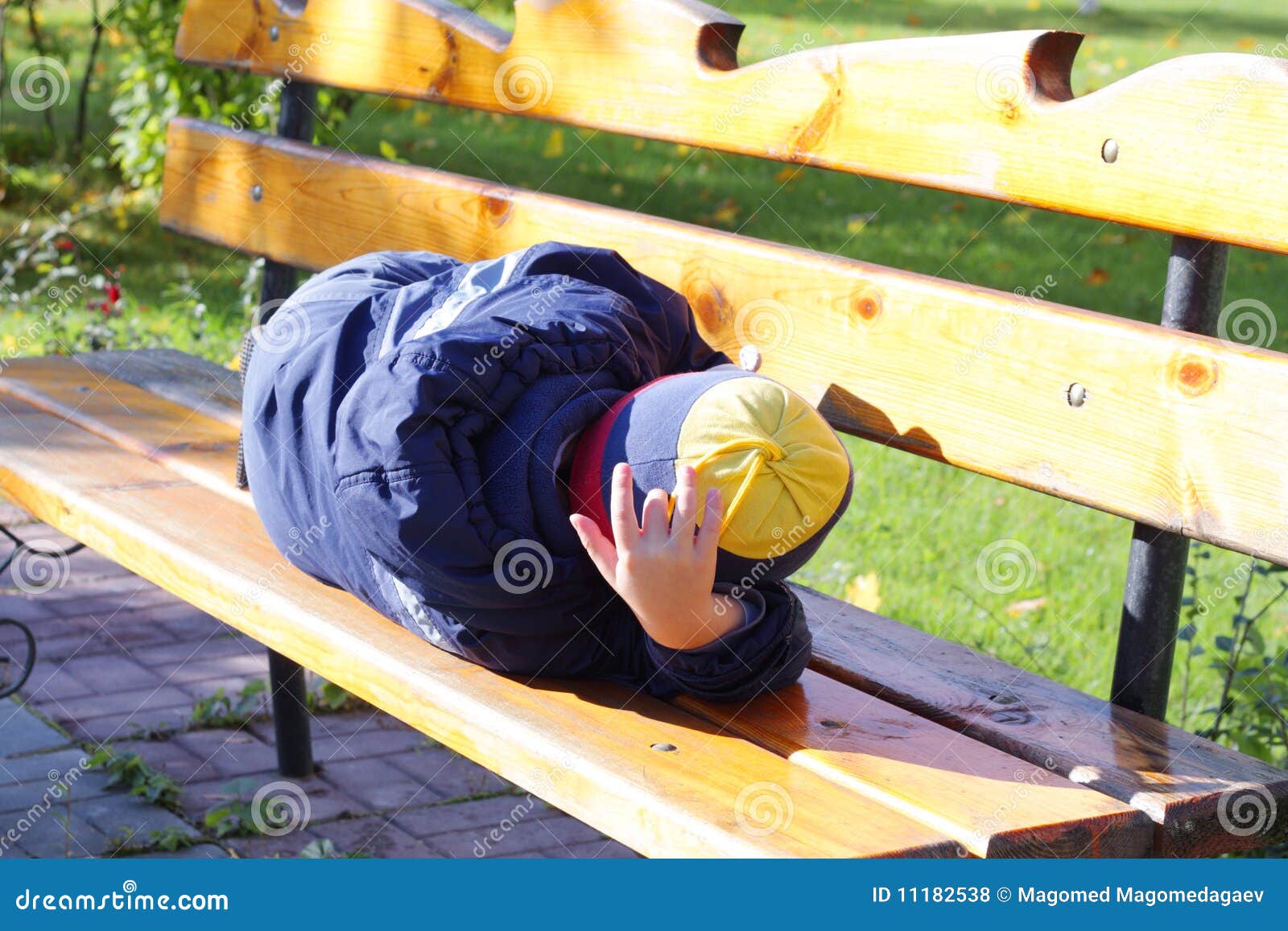 Boy sleeping on bench stock photo. Image of horizontal - 11182538