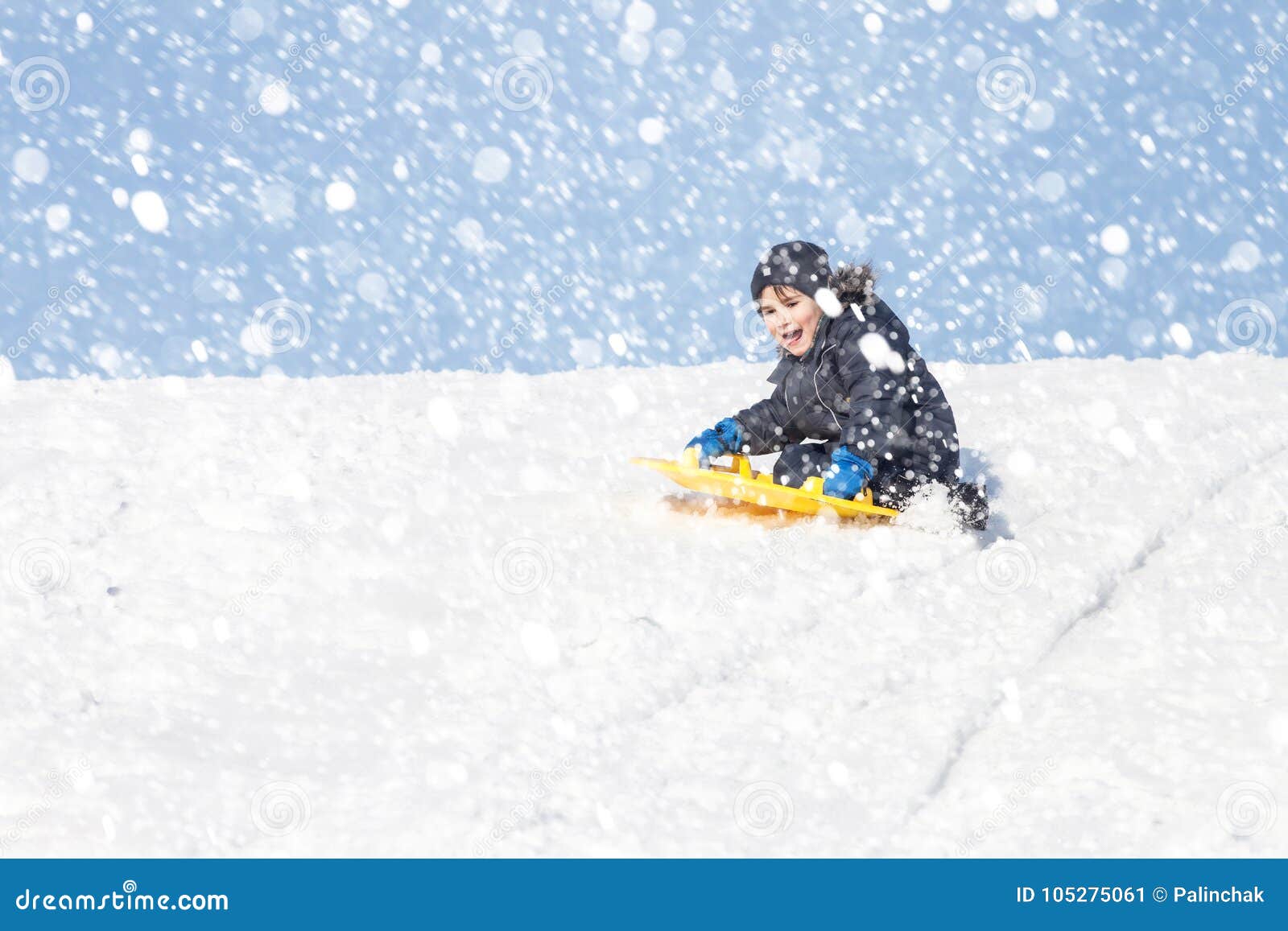 Sledding at winter time stock image. Image of adorable - 105275061