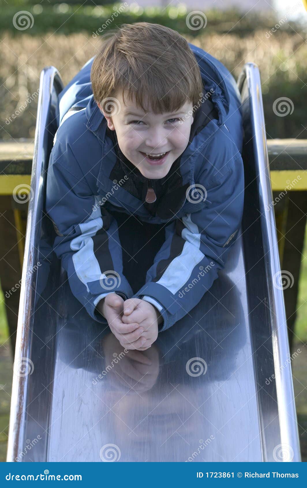 Boy on a slide stock image. Image of steel, white, person - 1723861