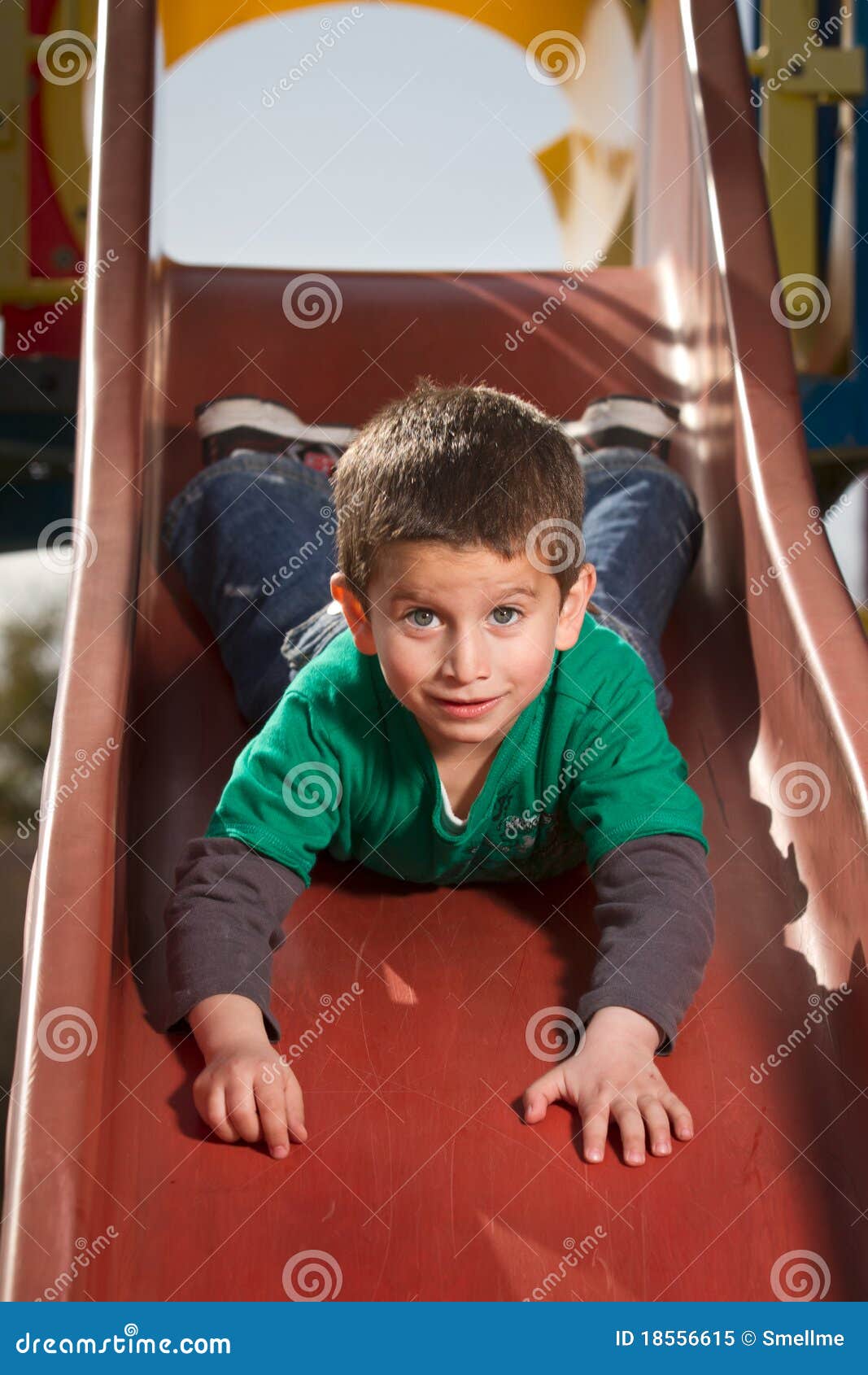 Boy on slide stock image. Image of outdoors, dizzy, adorable - 18556615