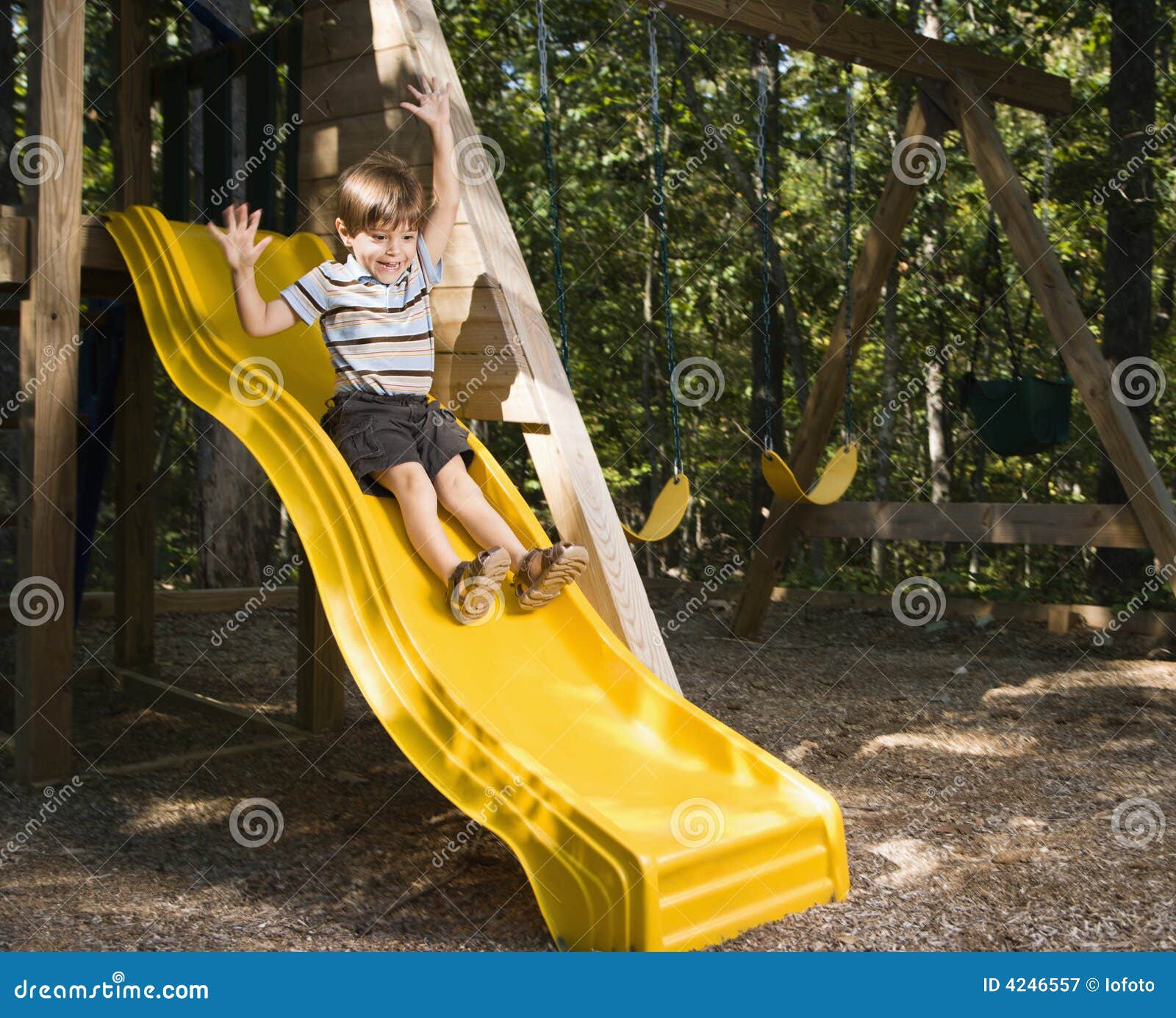 Boy on slide. stock image. Image of park, happy, slide - 4246557