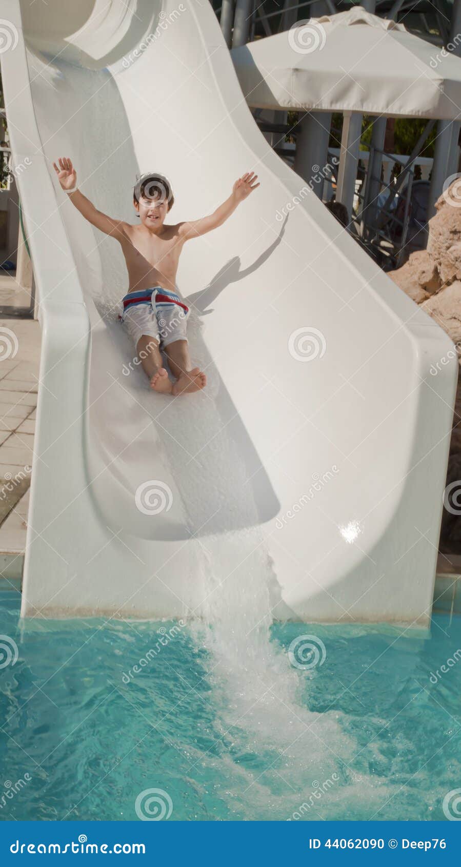 Boy on slide at waterpark stock photo. Image of nature - 44062090