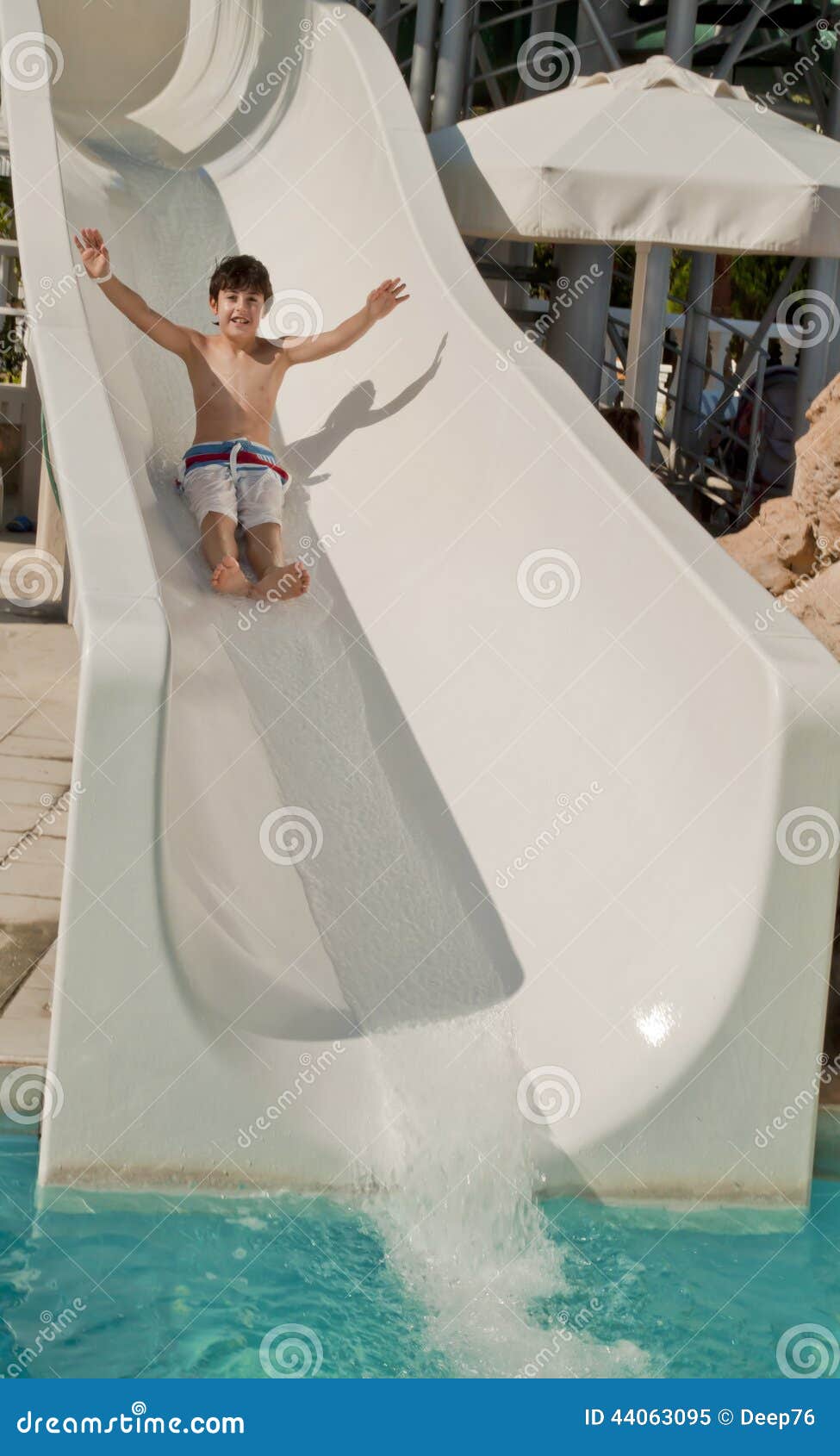 Boy on slide at waterpark stock image. Image of nature - 44063095