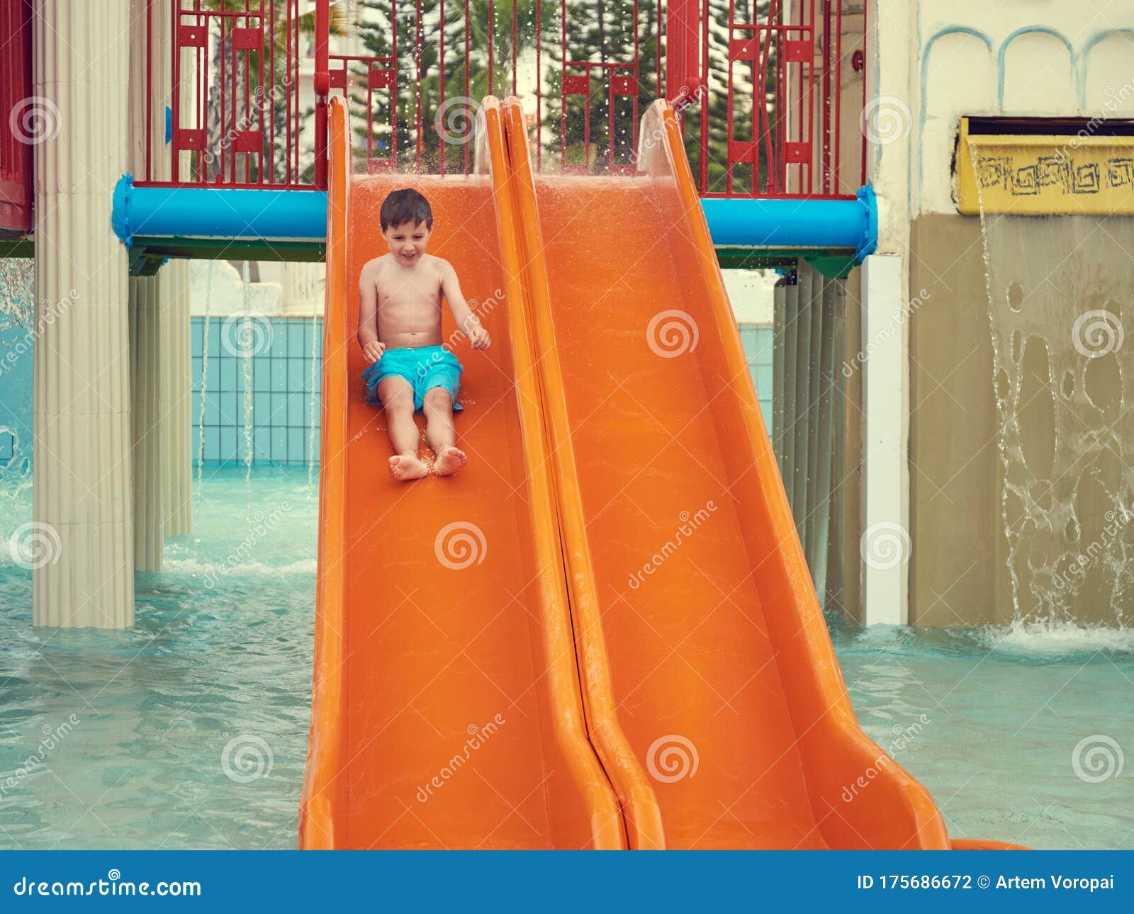 Boy Sliding Down Slide in Waterpark. Stock Photo - Image of aquapark ...