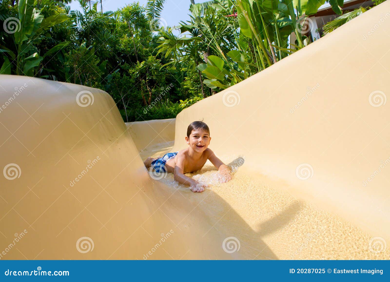 Boy Sliding Down Water Slide. Stock Image - Image of outdoor, speed ...