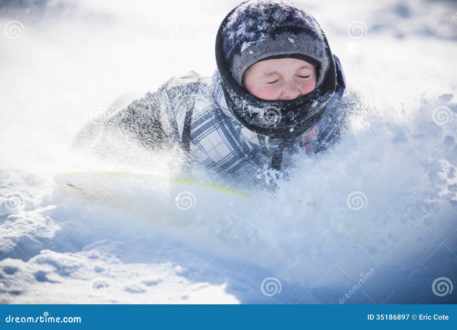 Boy sliding in the snow stock image. Image of human, snow - 35186897