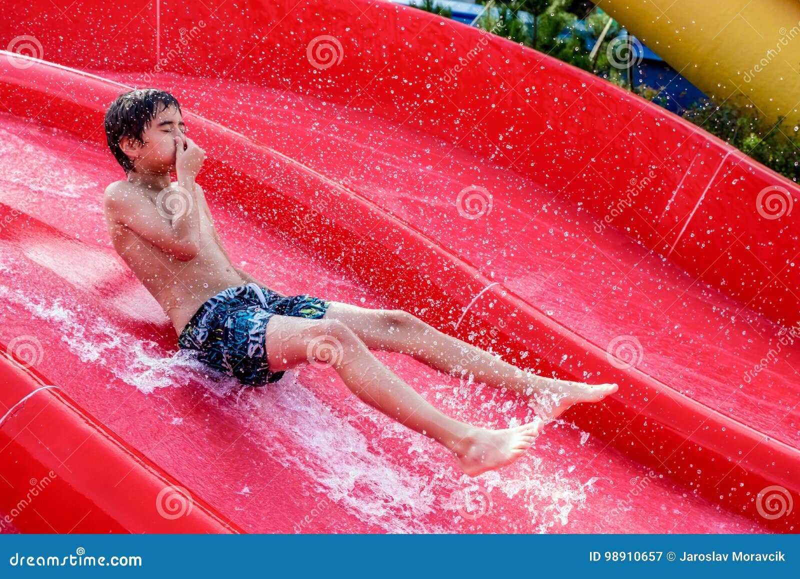 Boy Sliding on a Water Slide Stock Image - Image of park, female: 98910657