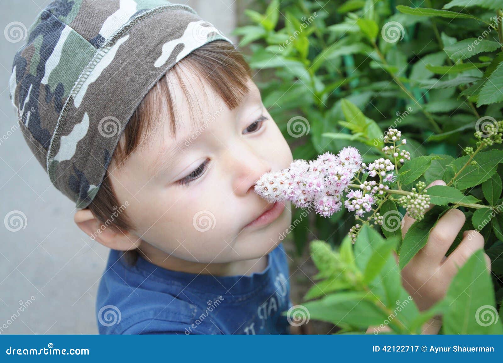 Boy smelling flower stock image. Image of feeling, life - 42122717