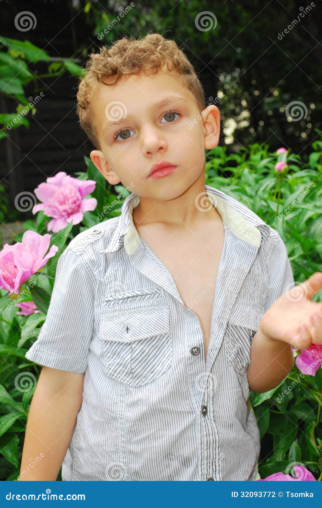 Boy smelling a peony. stock photo. Image of smile, years - 32093772