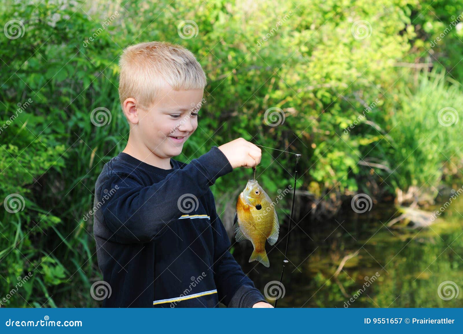 Boy Smiles Fishing stock image. Image of catch, fishing - 9551657