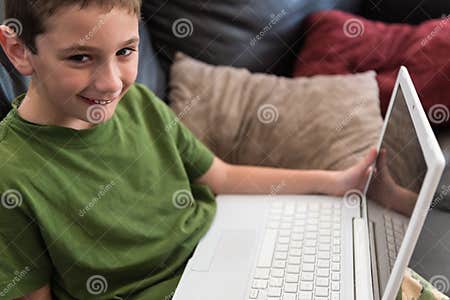 Boy smiling with computer stock photo. Image of little - 26526942